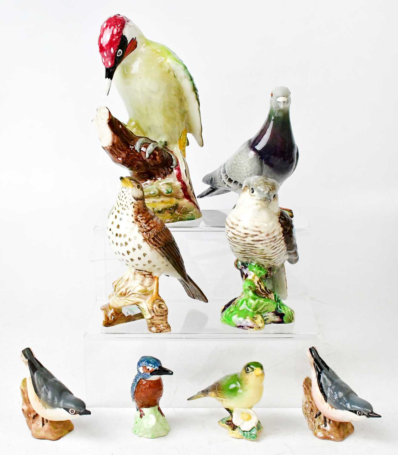 Lot 114 - BESWICK; eight models of birds, comprising