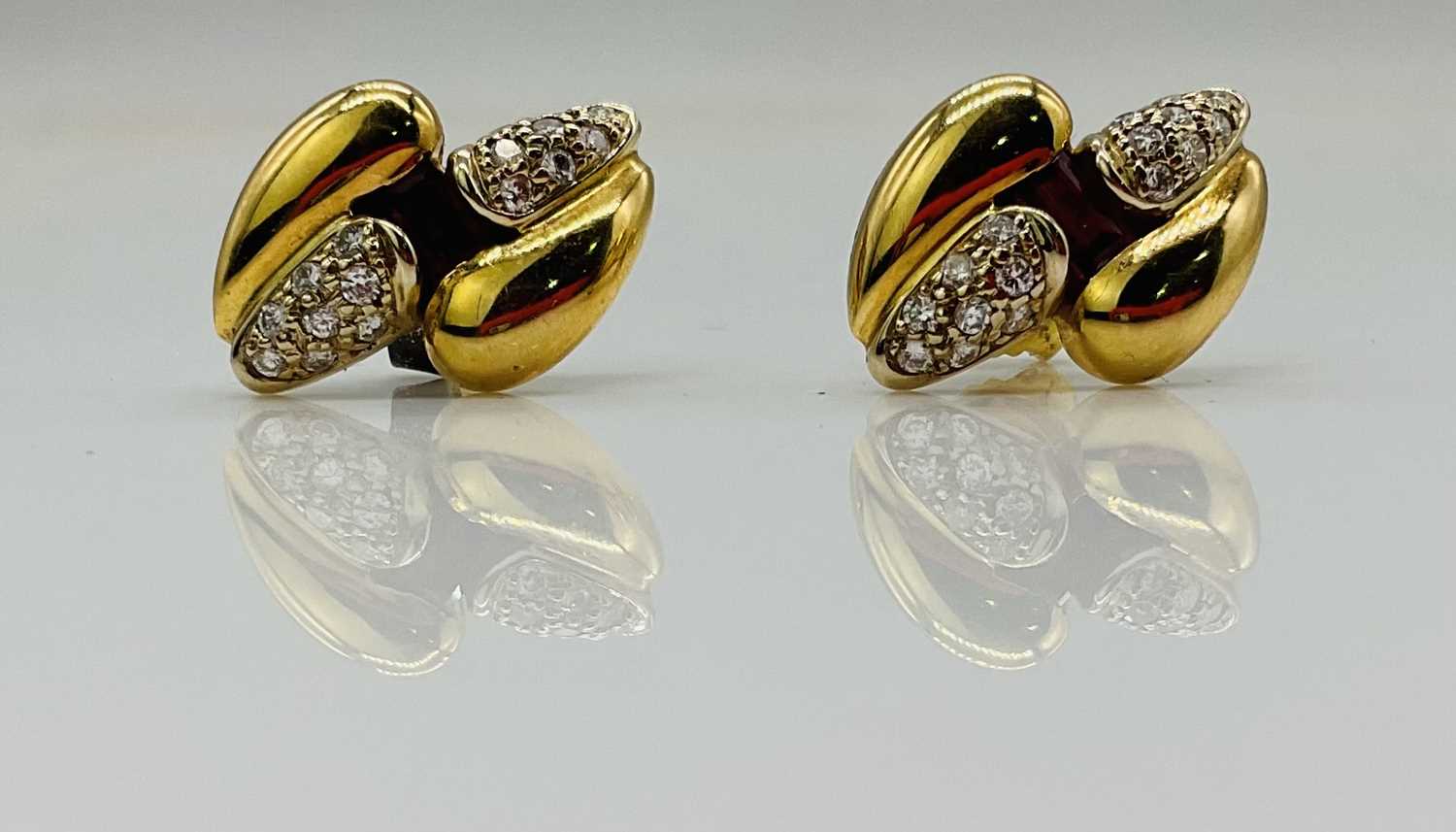 Lot 594 - A pair of 18ct yellow gold diamond and ruby