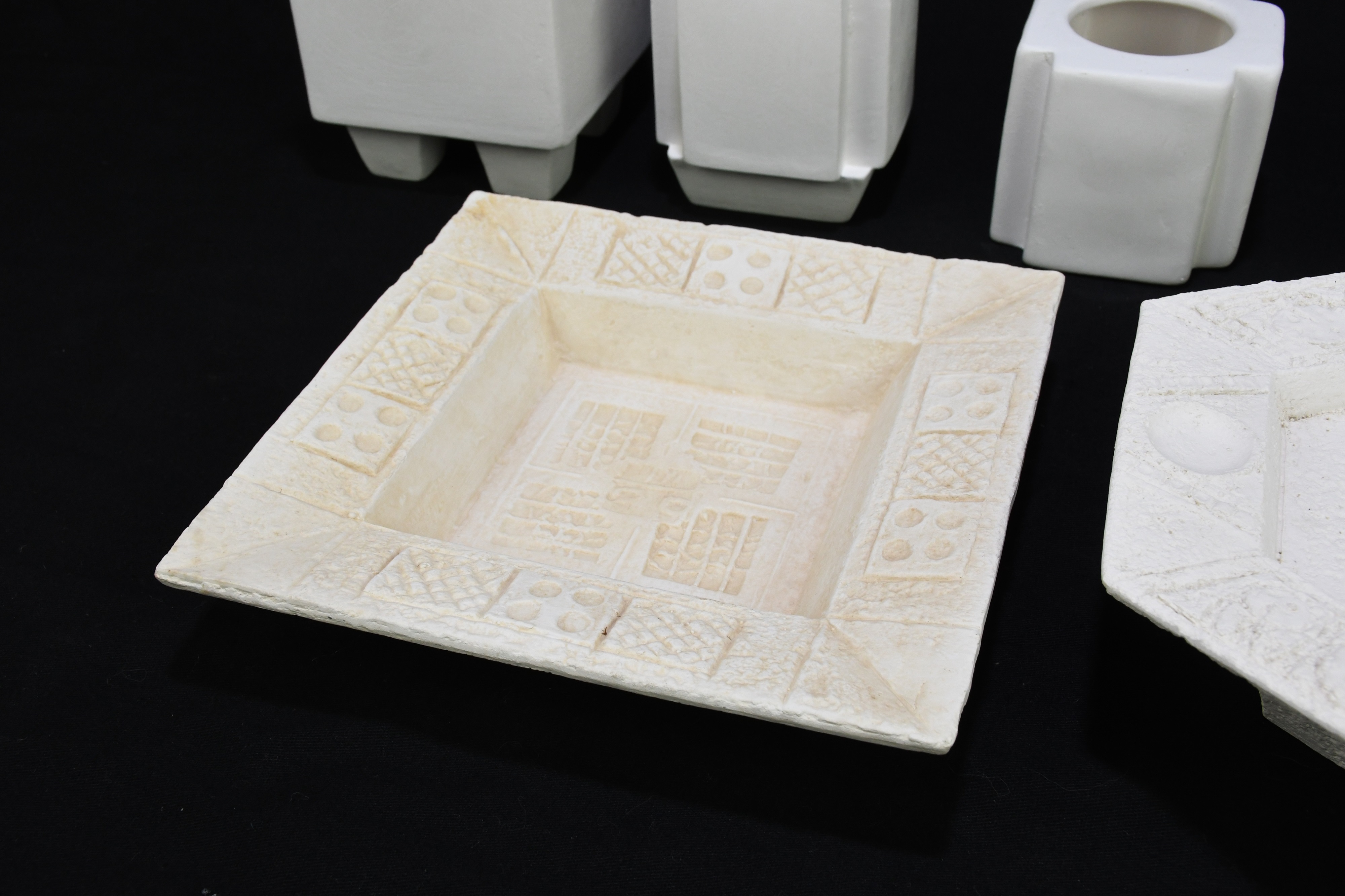 Lot 303 - TROIKA POTTERY; seven pieces of bisque ware,