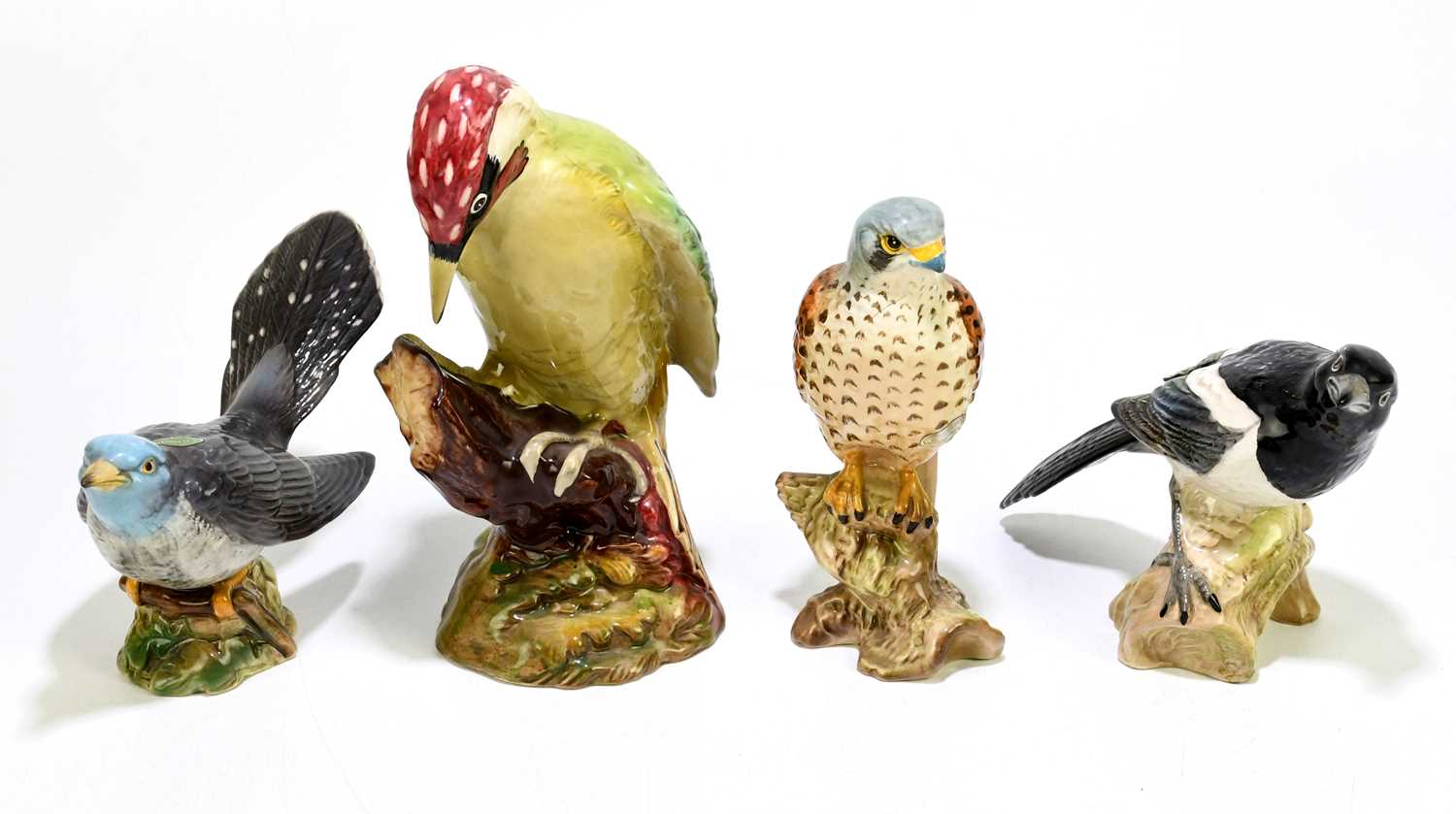 Lot 612 - BESWICK; a group of four figures to include