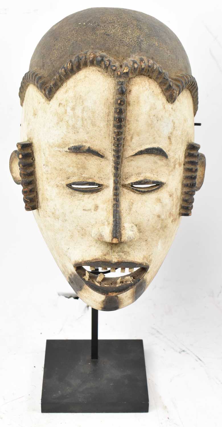 Lot 67 - An Idoma, Nigeria, mask with black and white