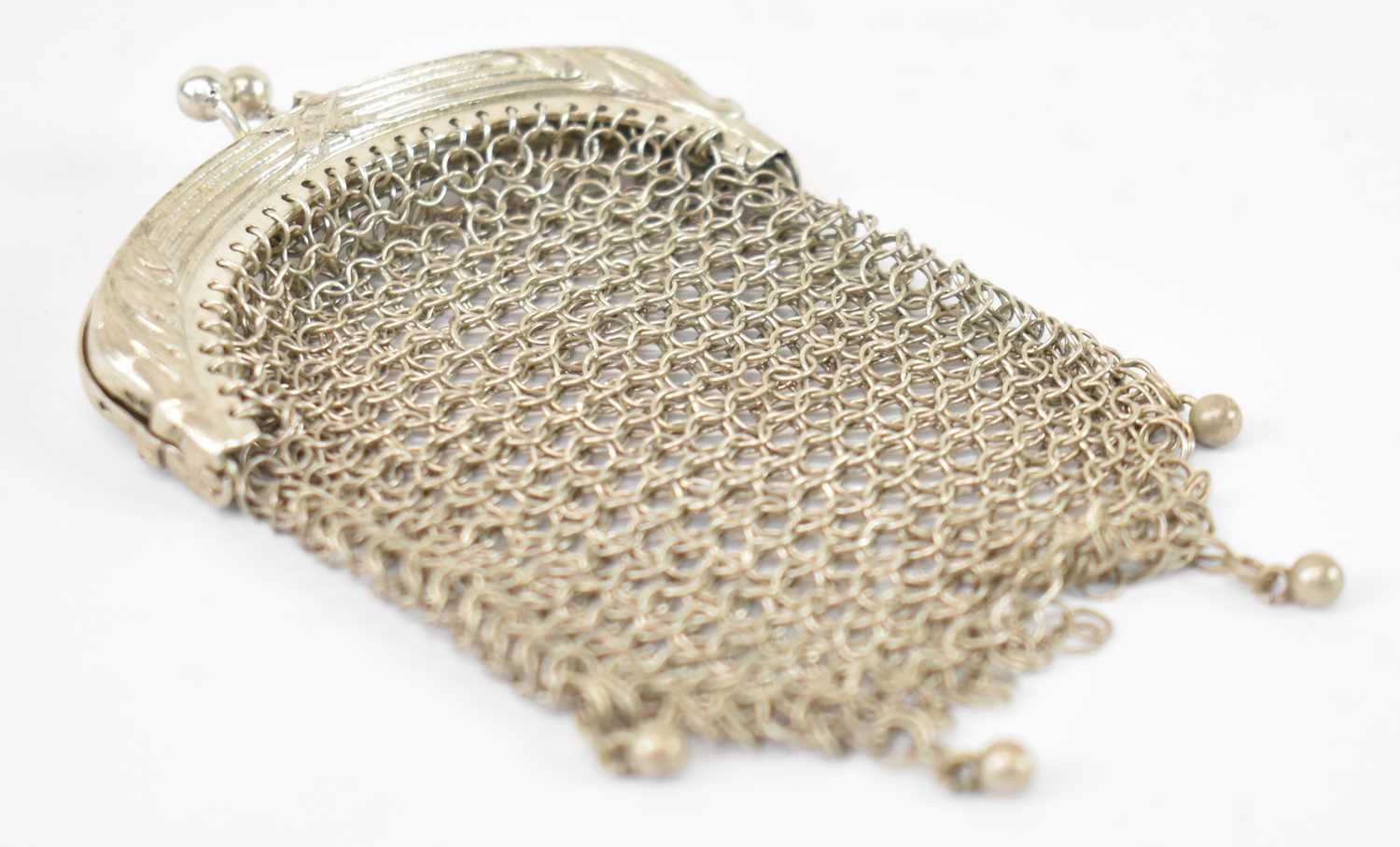 Lot 665 - An Eastern white metal mesh purse.