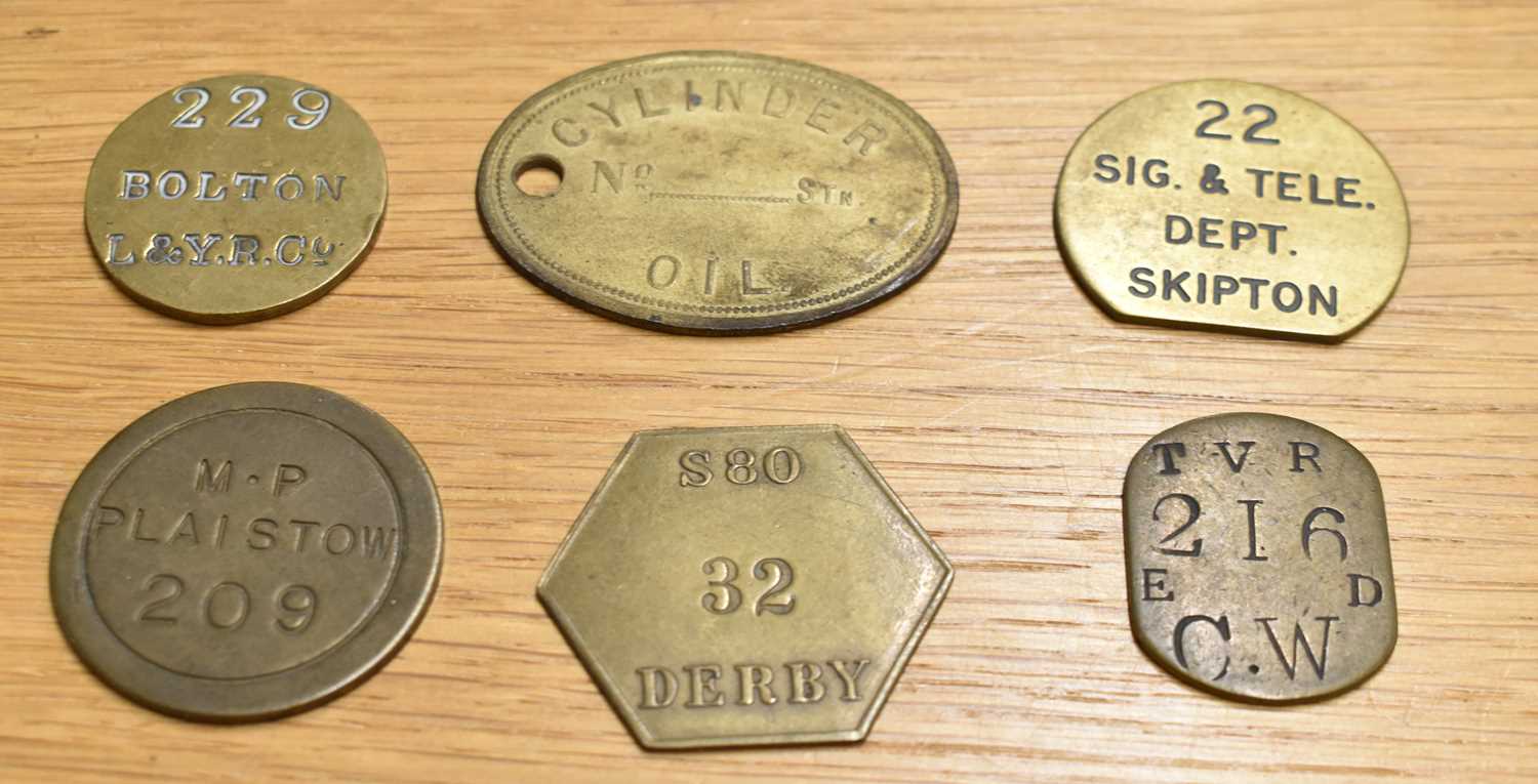 Lot 256 - GWR; six assorted brass tokens/tallies