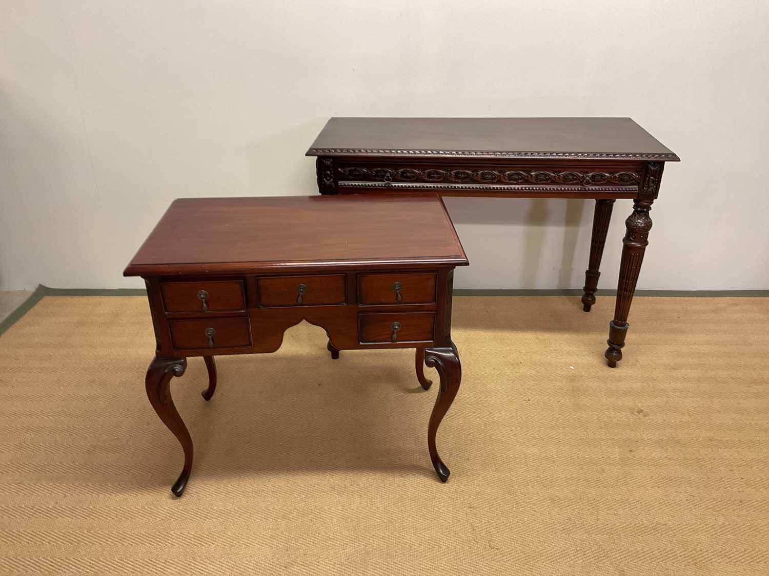 Lot 788 - A reproduction hall table with carved detail,