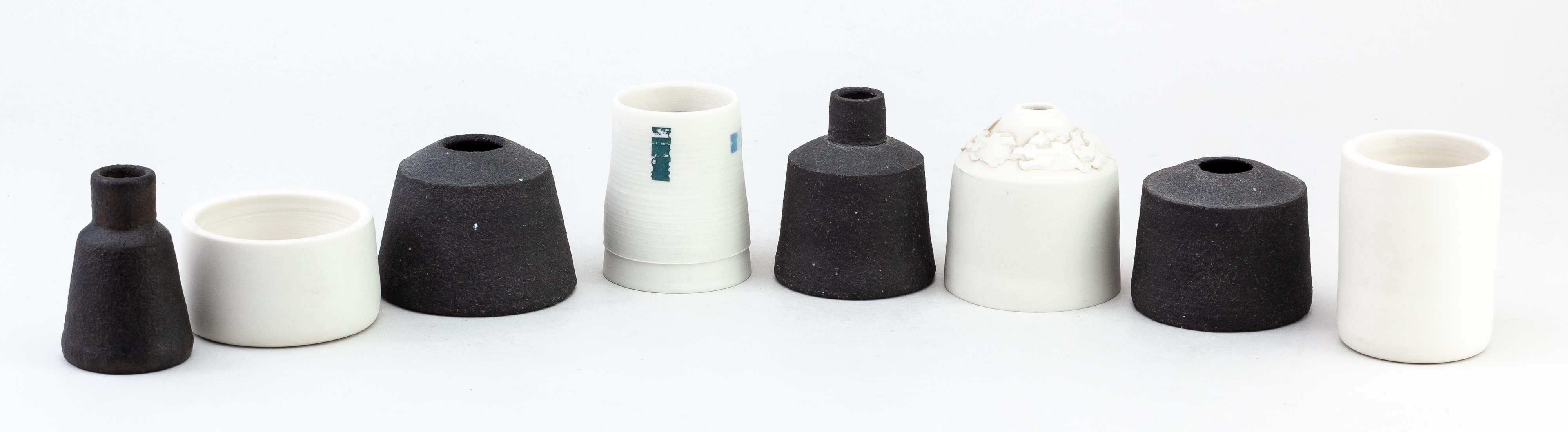 Lot 39 - ALISON REES; a group of eight small black