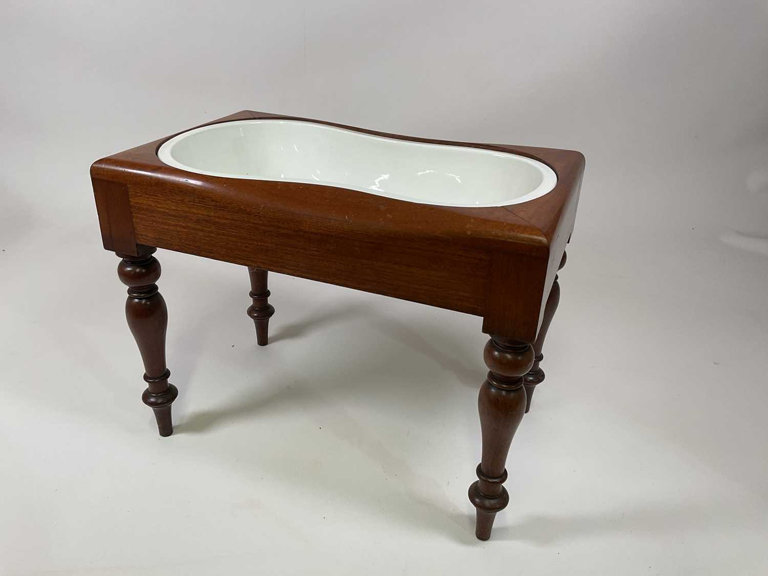 Lot 713 - A Victorian bidet with ceramic slip, height