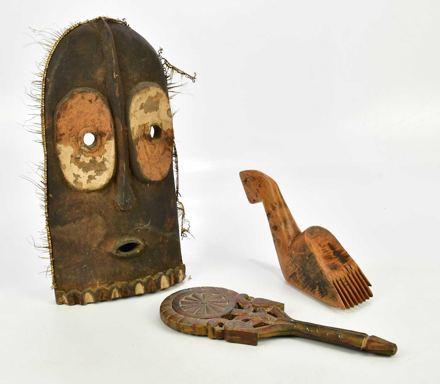 Lot 2594 - A carved wood African tribal mask, possibly