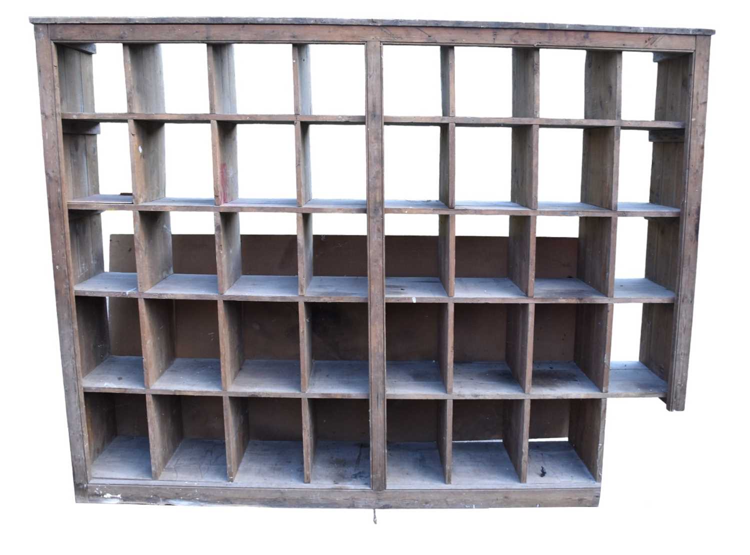 Lot 1165 - An old pine pigeon hole/shelf, width 235cm.